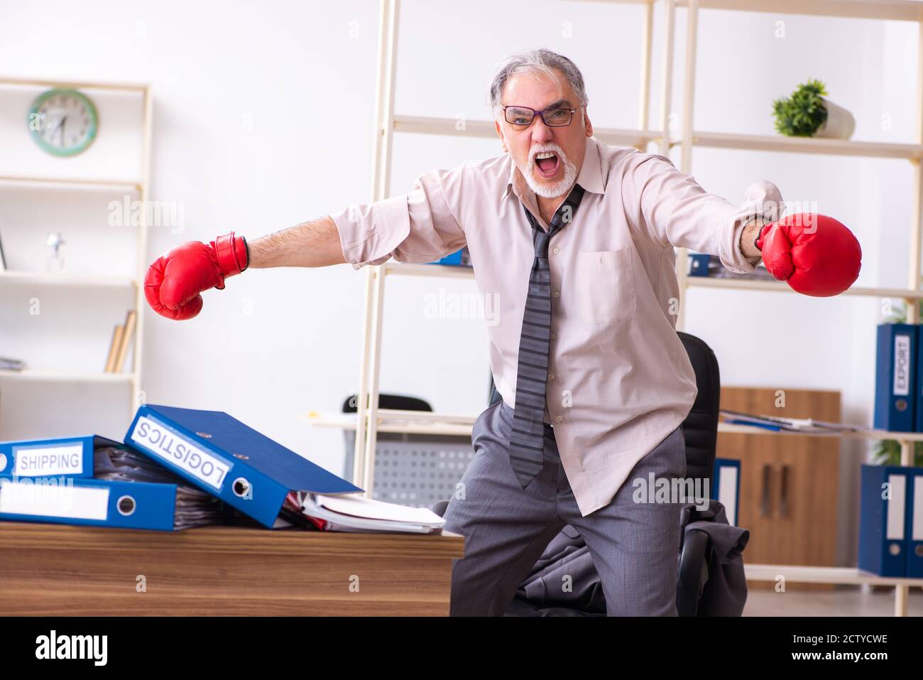 Businessman angry and furious at his workplace Stock Photo - Alamy