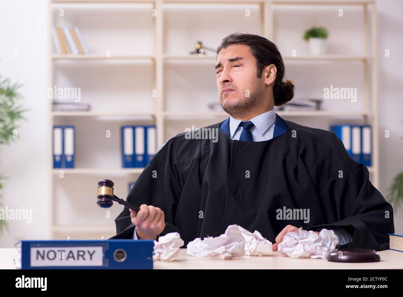 Young judge working in courthouse Stock Photo - Alamy