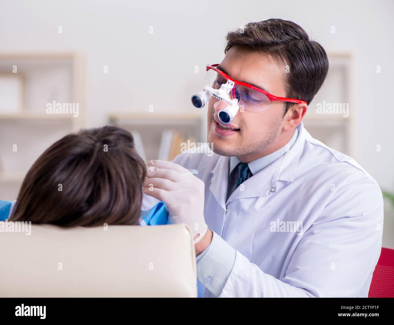 The patient visiting dentist for regular check-up and filling Stock ...