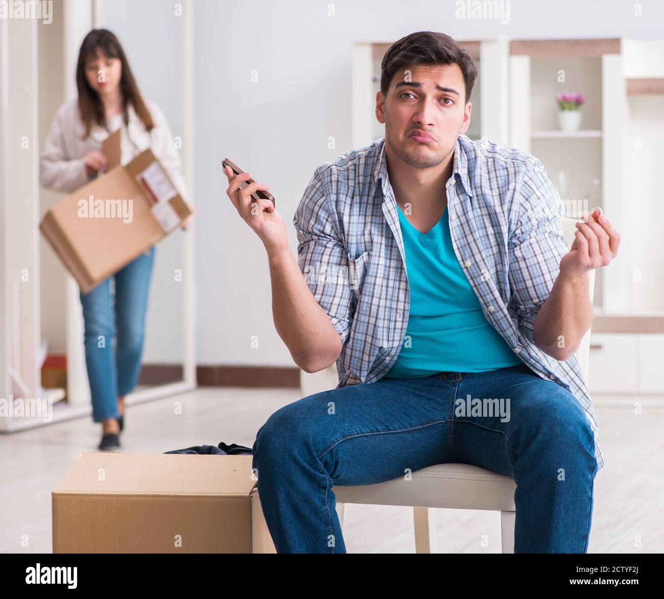 The woman evicting man from house during family conflict Stock Photo ...