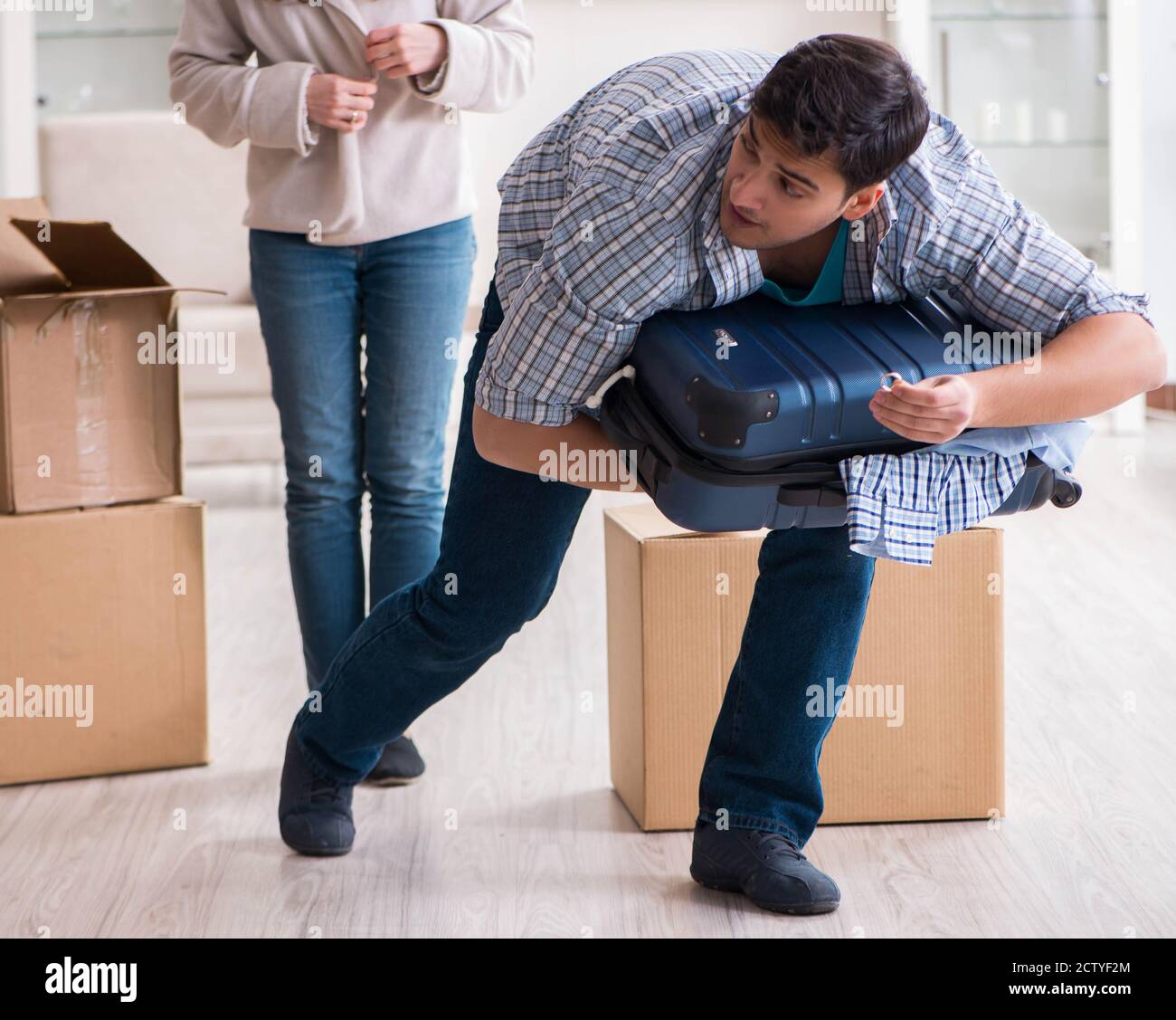 The woman evicting man from house during family conflict Stock Photo ...