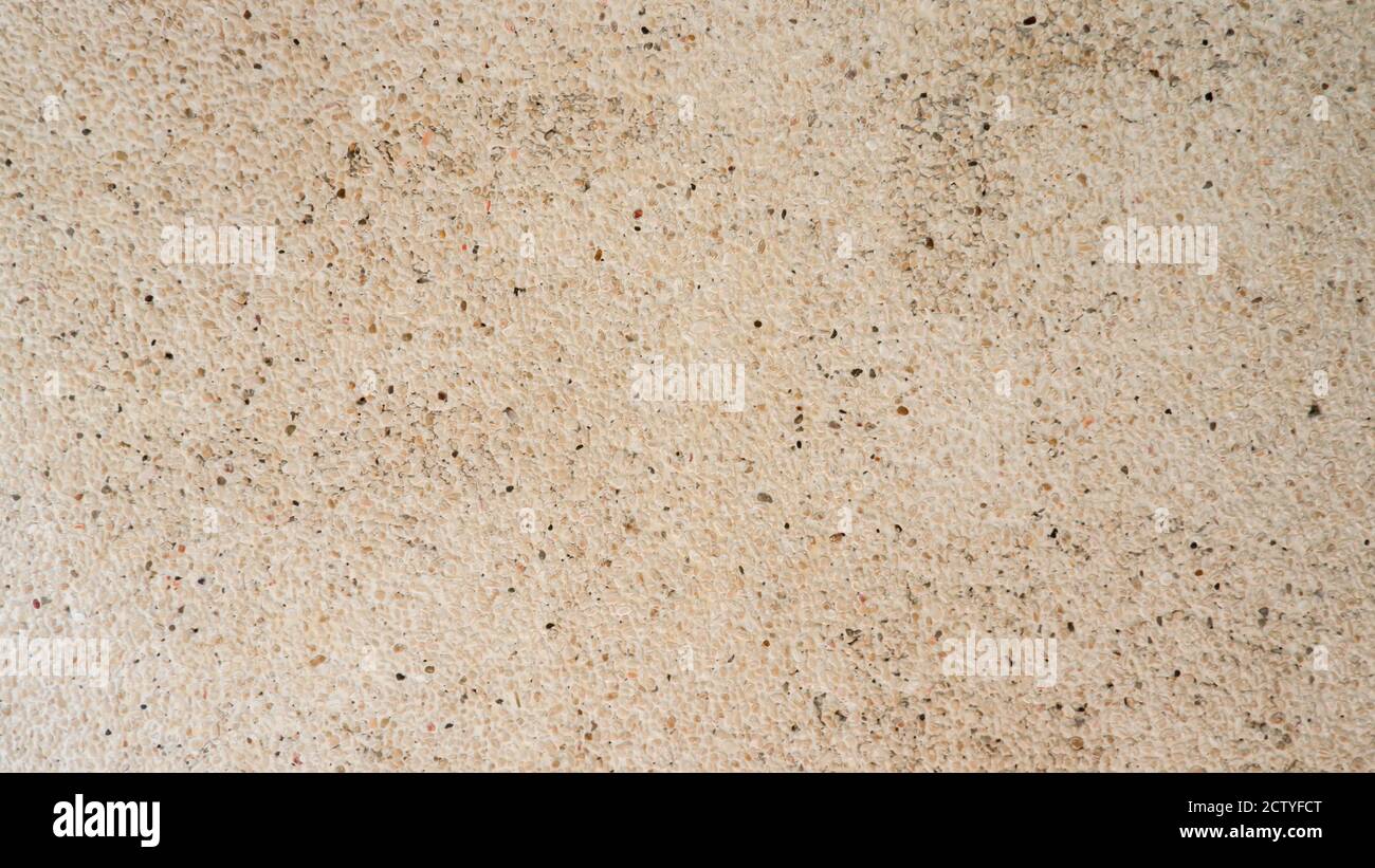 Pebble wash wall finish texture Stock Photo - Alamy