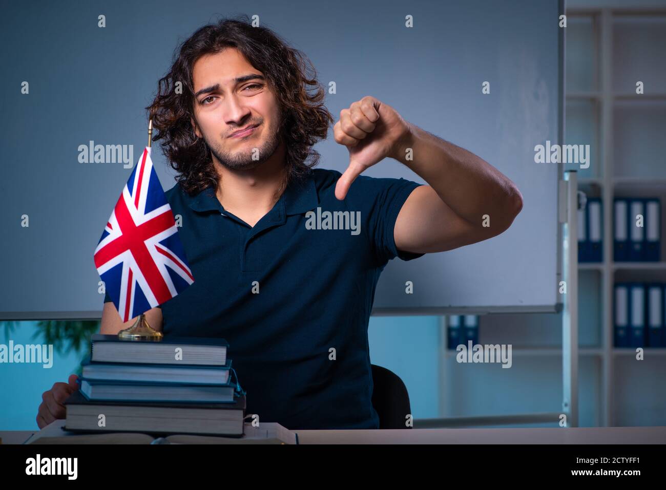 Young student in the classroom at night Stock Photo - Alamy