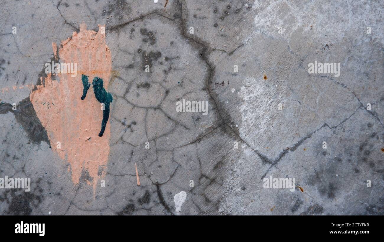 Cracked concrete texture with splash of paint Stock Photo - Alamy