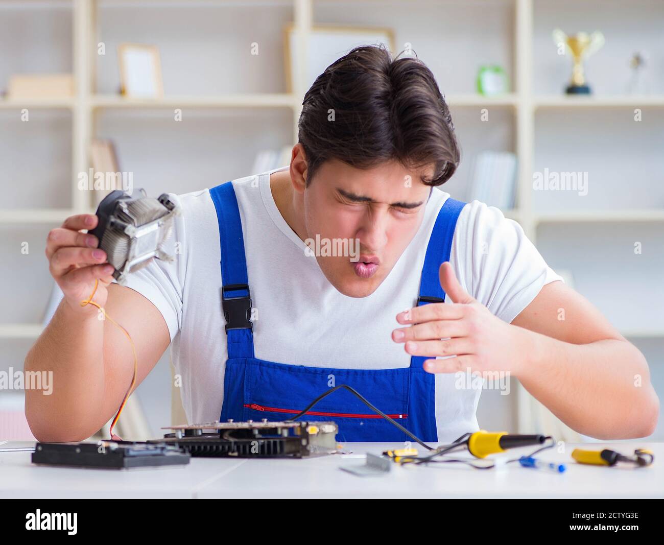 The computer repairman repairing desktop computer Stock Photo - Alamy