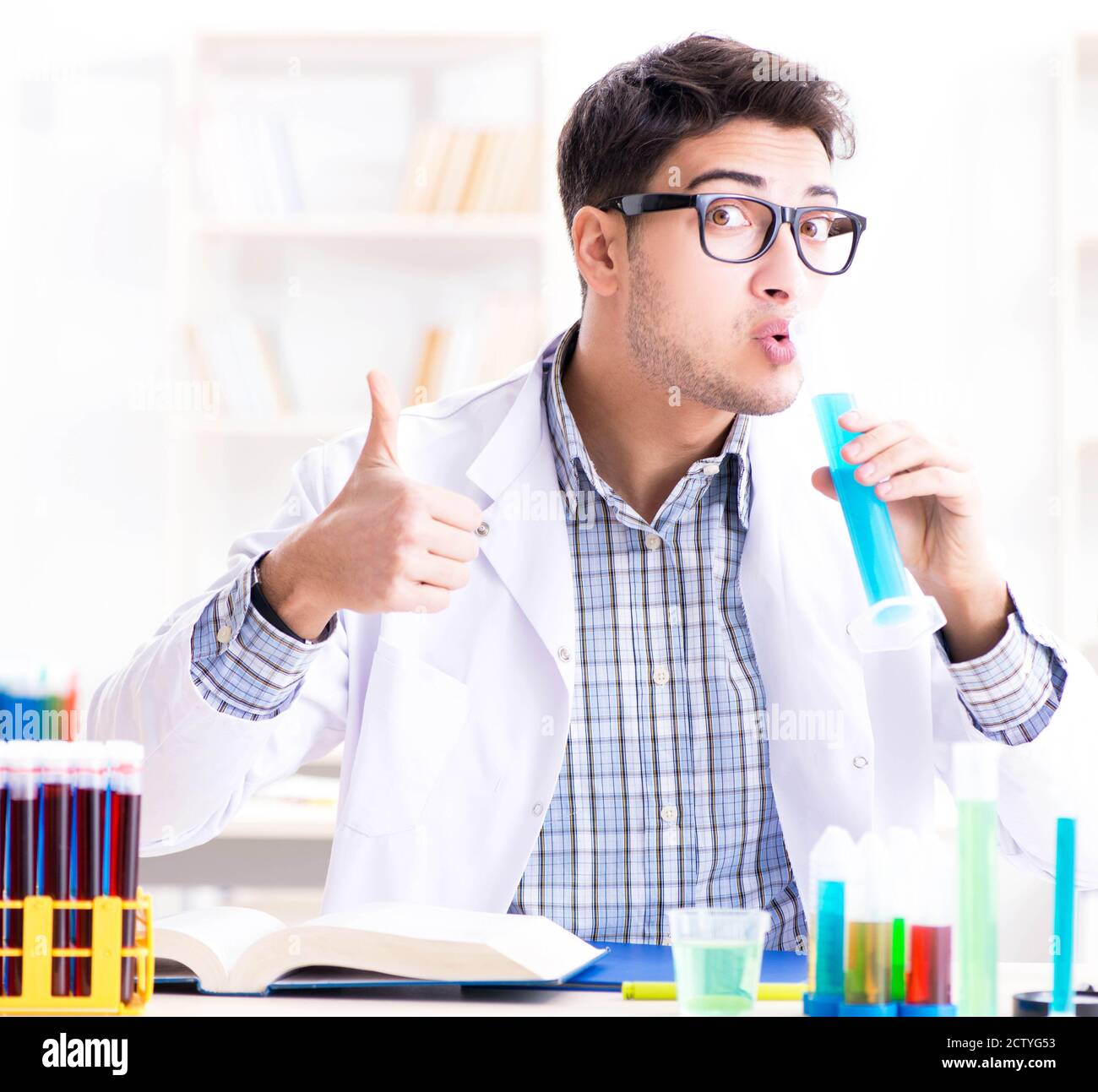 Chemistry student doing chemical experiments at classroom activity ...