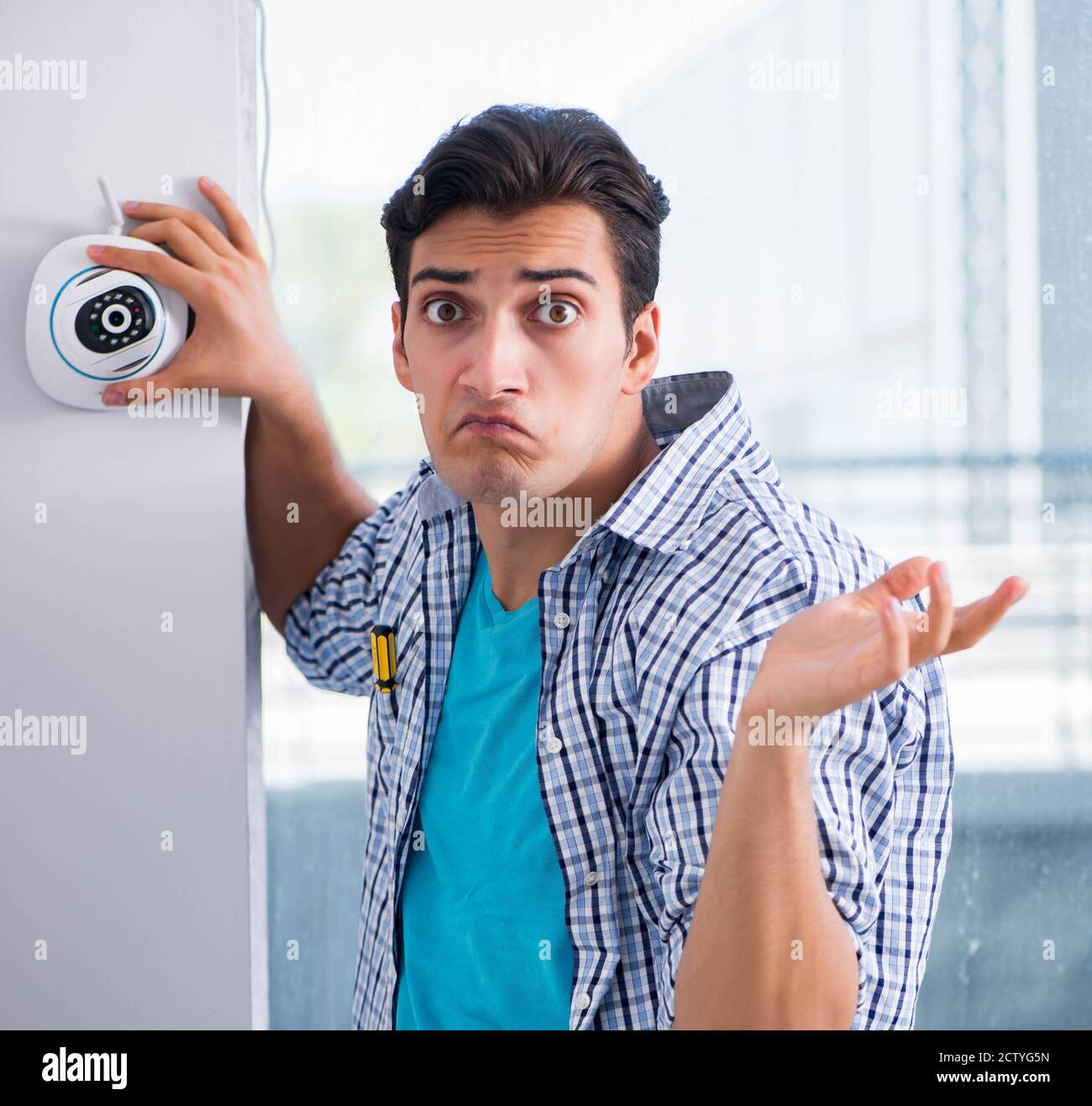The man installing surveillance cctv cameras at home Stock Photo - Alamy