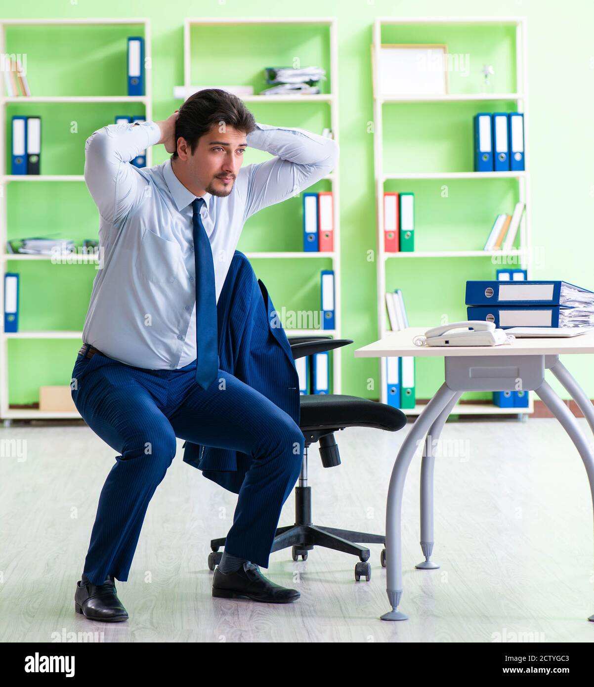 The employee doing exercises during break at work Stock Photo - Alamy