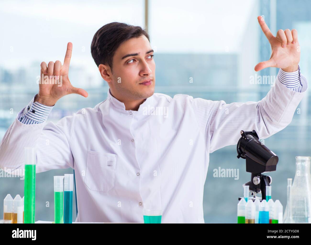 The young chemist pressing virtual buttons in lab Stock Photo - Alamy