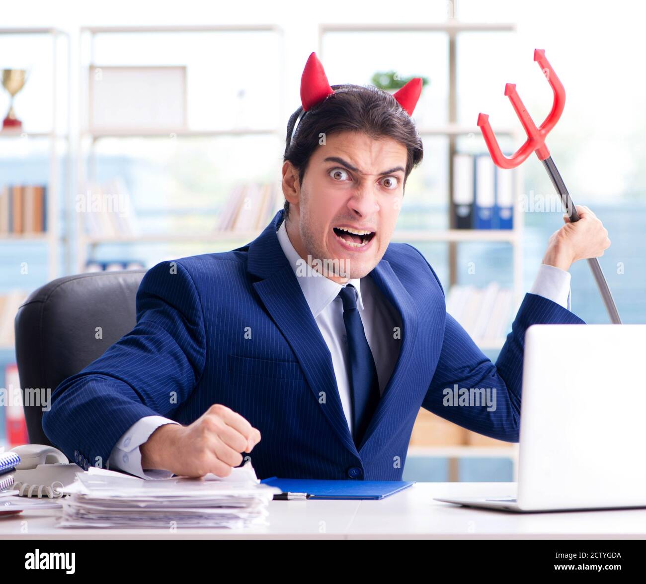 The devil angry businessman in the office Stock Photo - Alamy