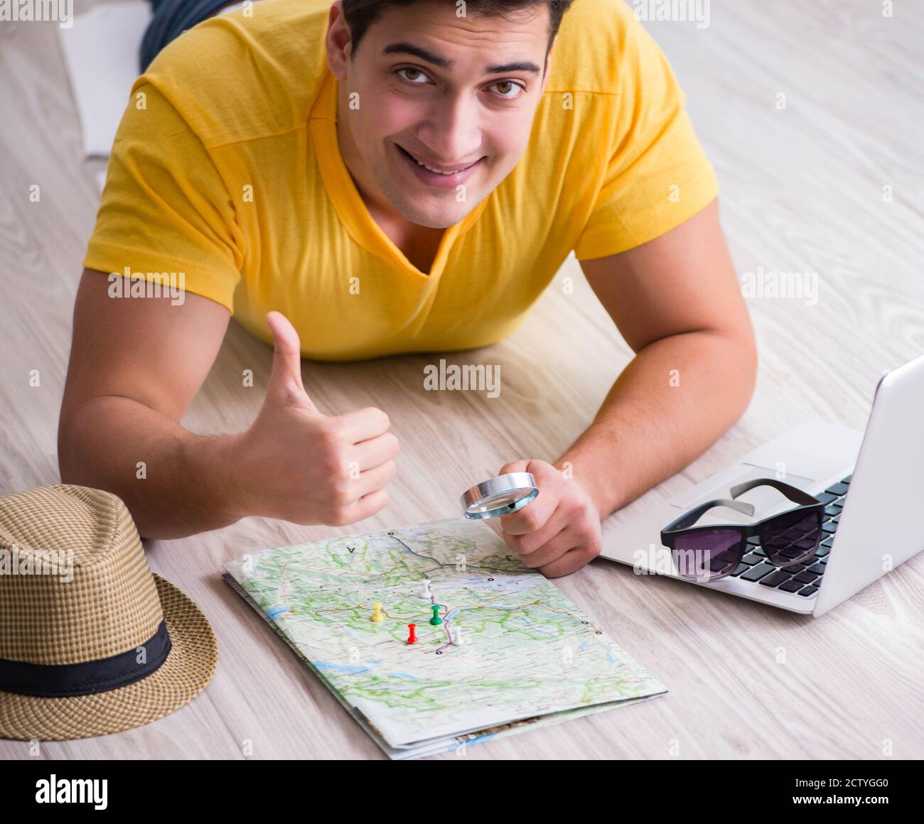 The man planning his vacation trip with map Stock Photo - Alamy