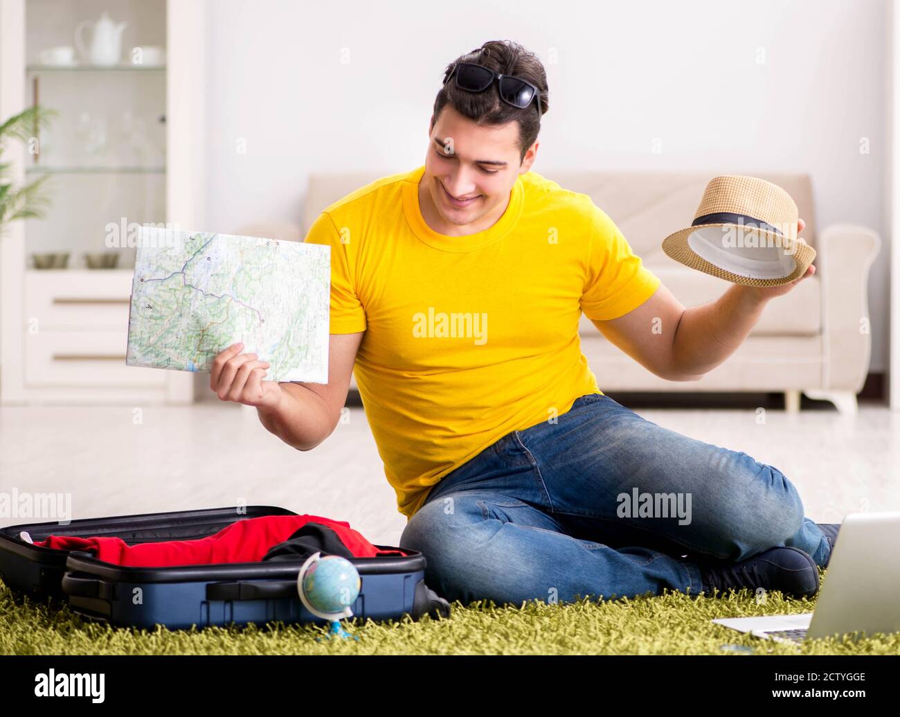 The man planning his vacation trip with map Stock Photo - Alamy