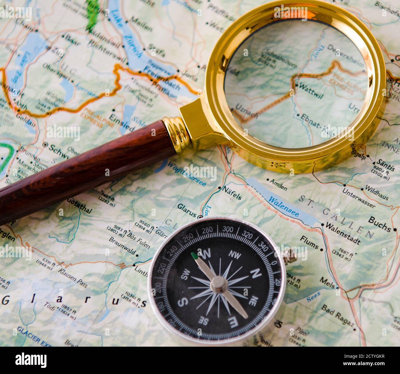 The travel concept with compass and map Stock Photo - Alamy
