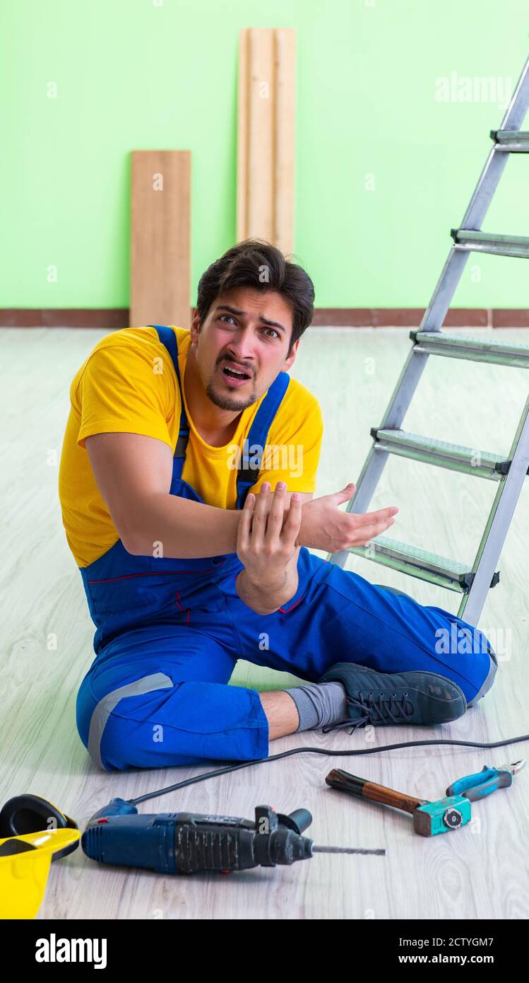 The injured worker at the work site Stock Photo - Alamy
