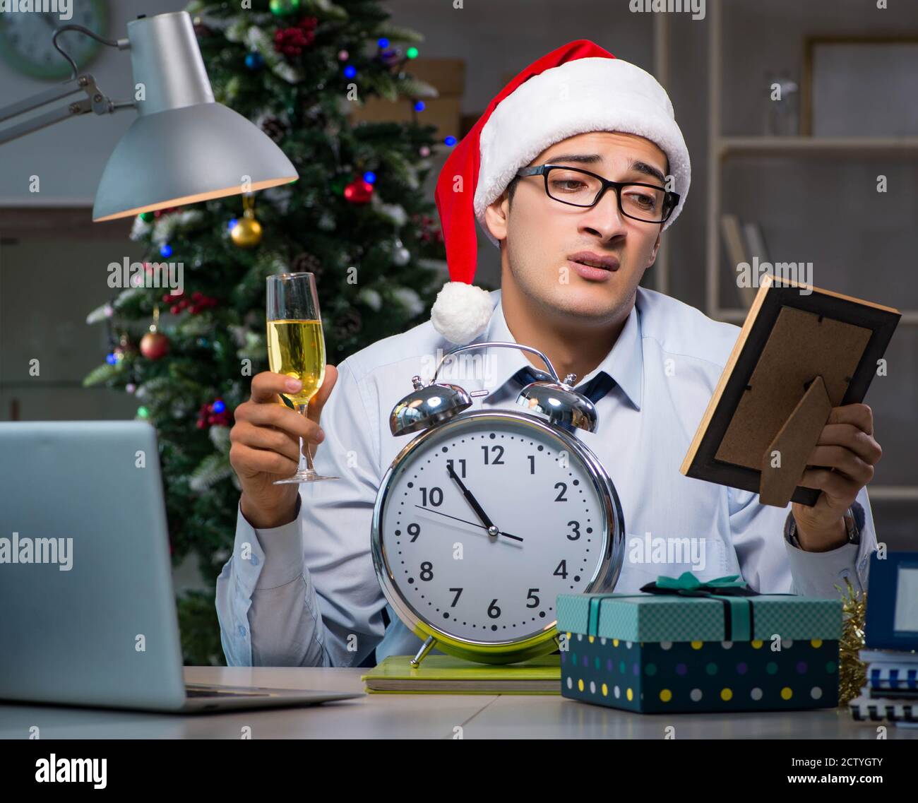 The businessman working late on christmas day in office Stock Photo - Alamy
