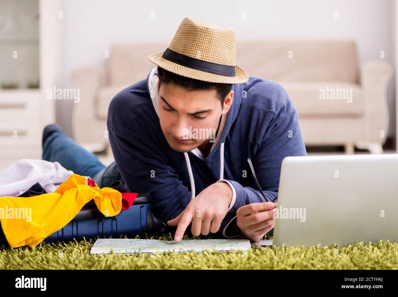 The man planning his vacation trip with map Stock Photo - Alamy