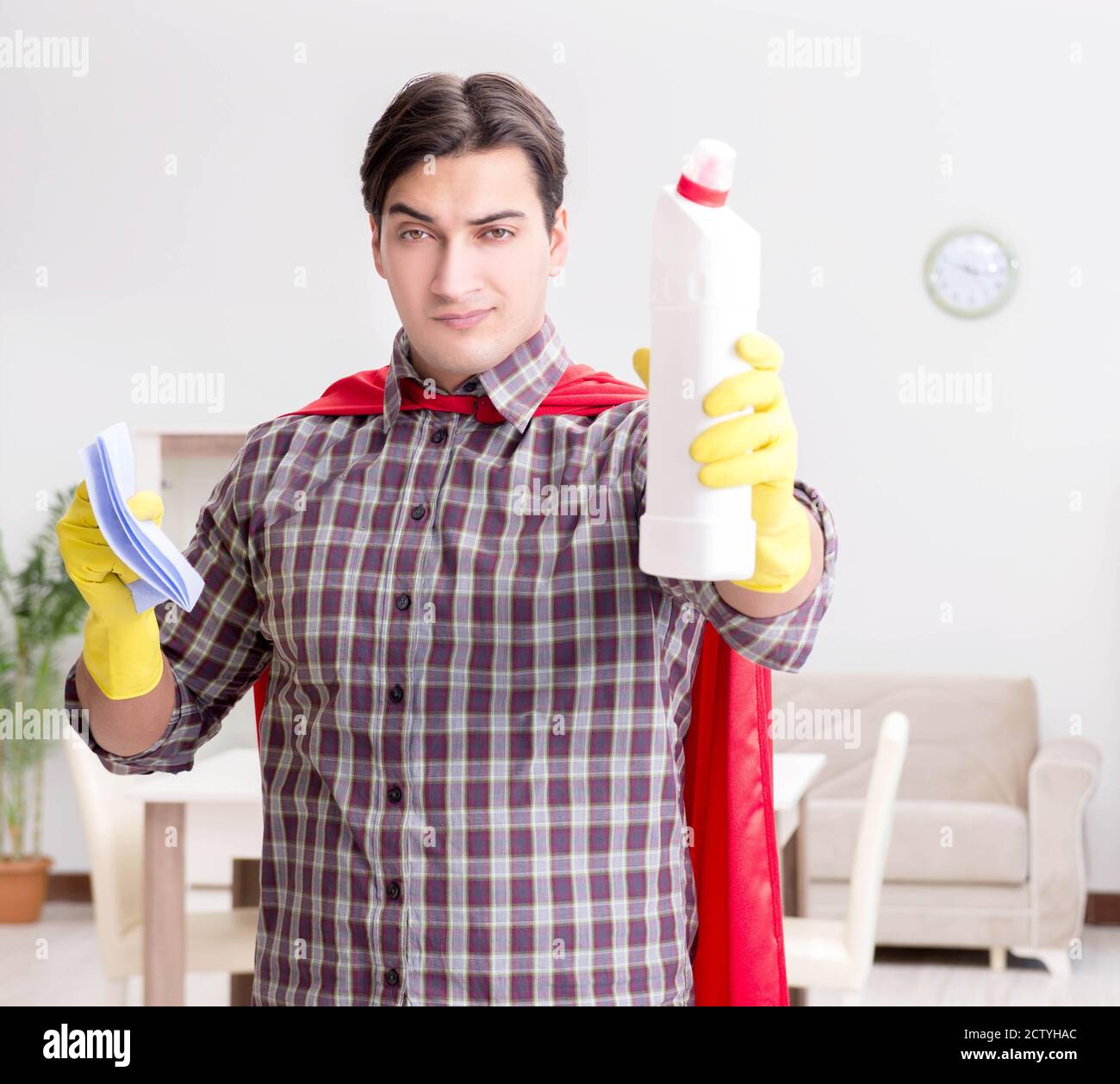 The super hero cleaner doing housework Stock Photo - Alamy