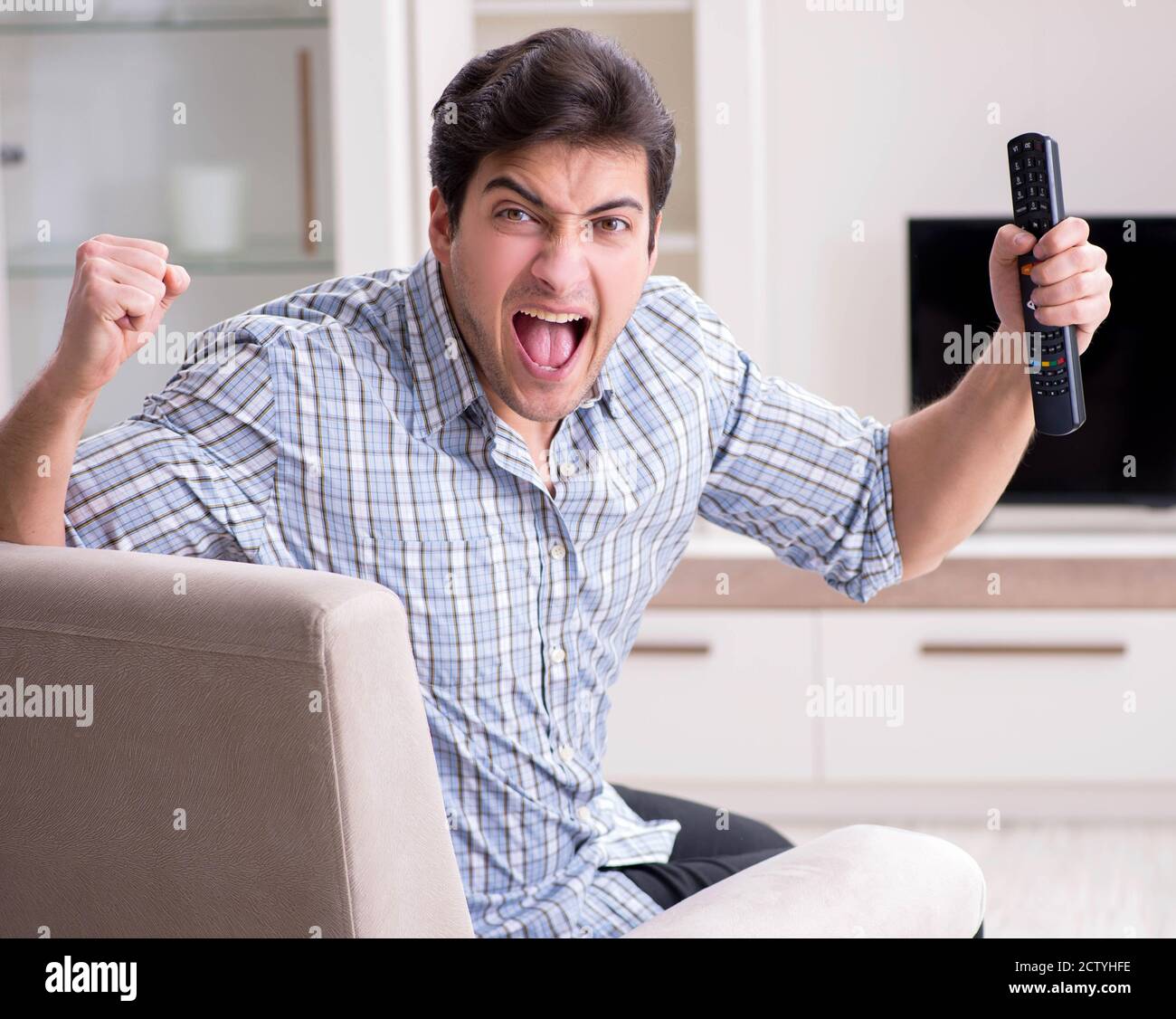 The man trying to fix broken tv Stock Photo - Alamy