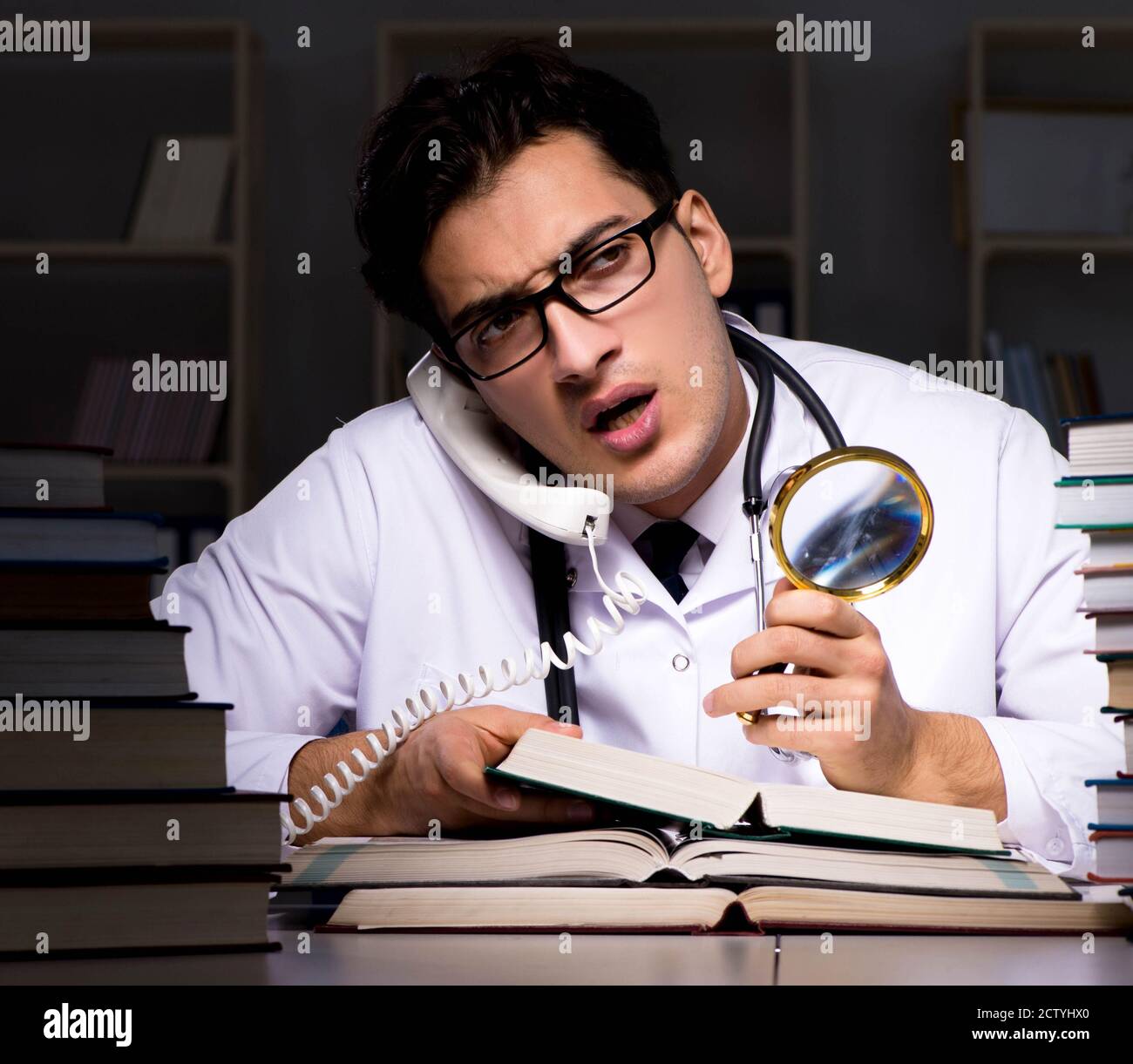 The medical student preparing for university exams at night Stock Photo ...