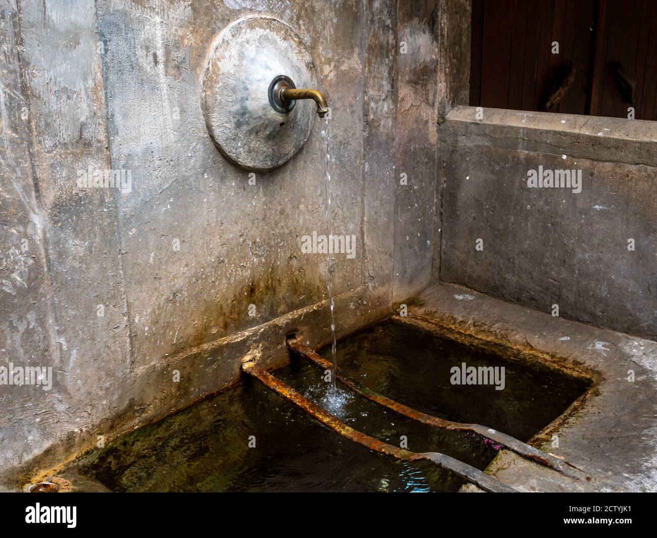 traditional stone water fountain in small French Alps village Saint ...