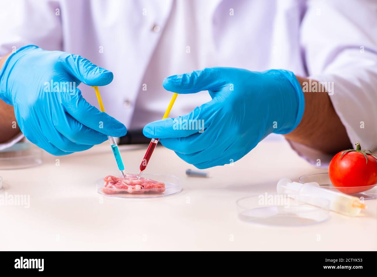 Young nutrition expert testing food products in lab Stock Photo - Alamy