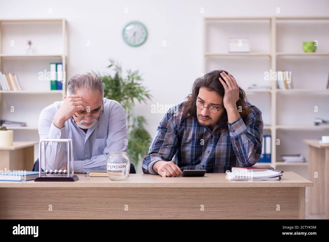 Two employees in the retirement concept Stock Photo - Alamy