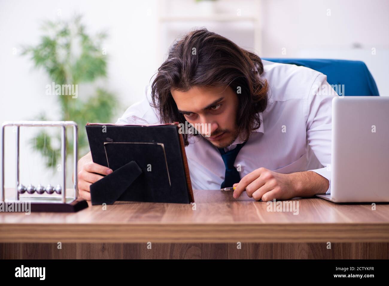 Drug addicted employee working in the office Stock Photo - Alamy