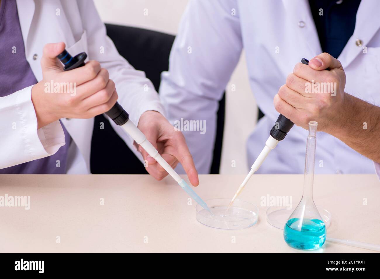 Young father and son chemists in the laboratory Stock Photo - Alamy