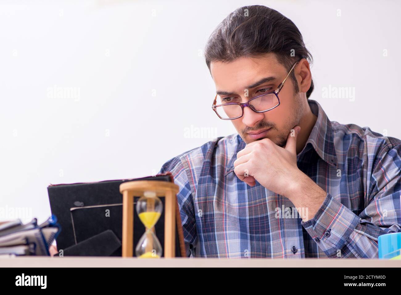 Young student sitting in the classroom Stock Photo - Alamy