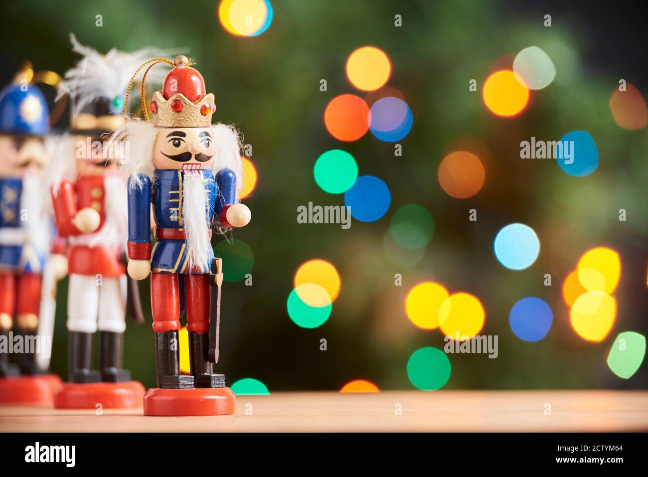 Traditional colorful Christmas nutcrackers with a green background with ...