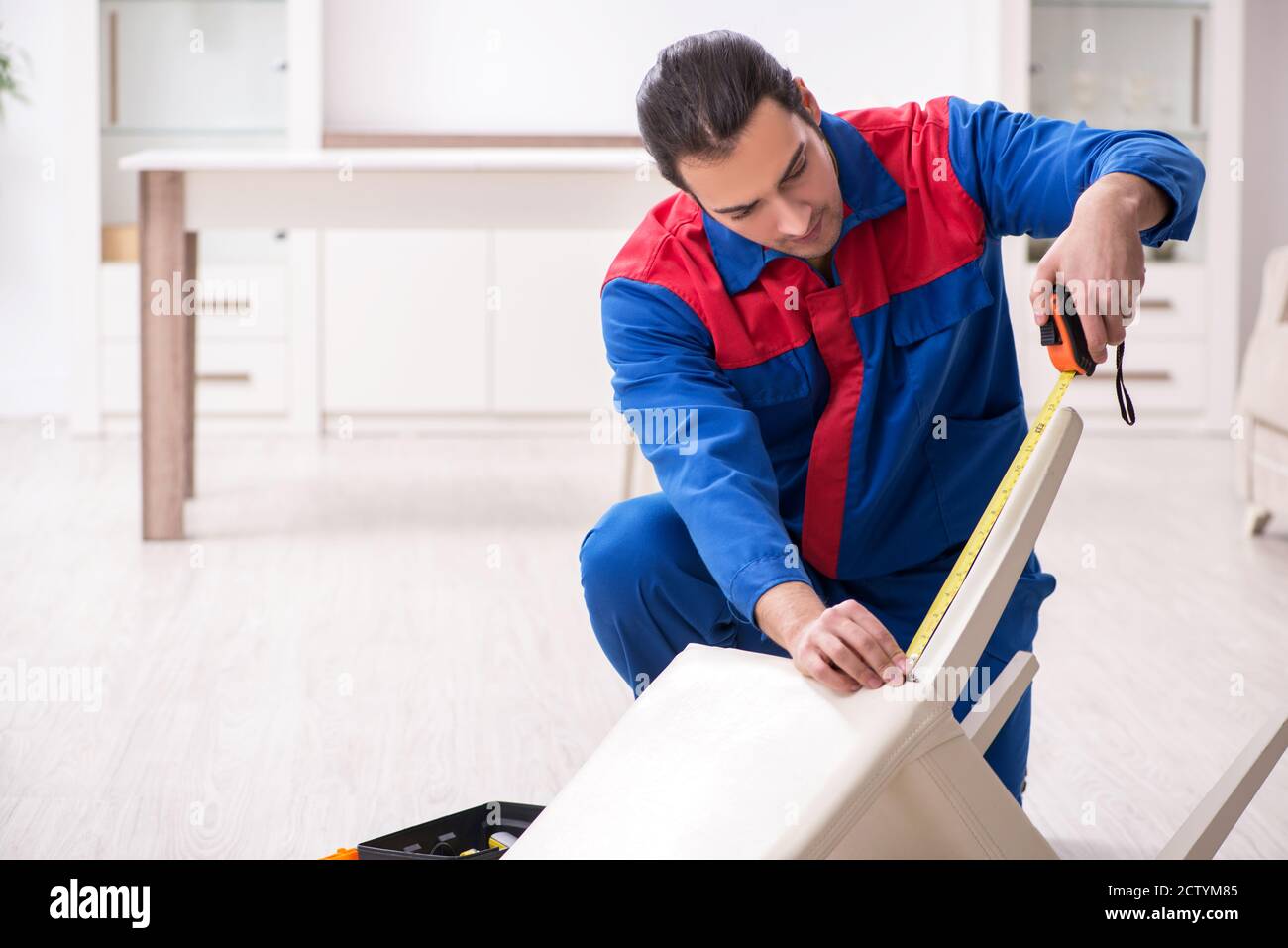 Carpenter measuring wooden chair hi-res stock photography and images ...