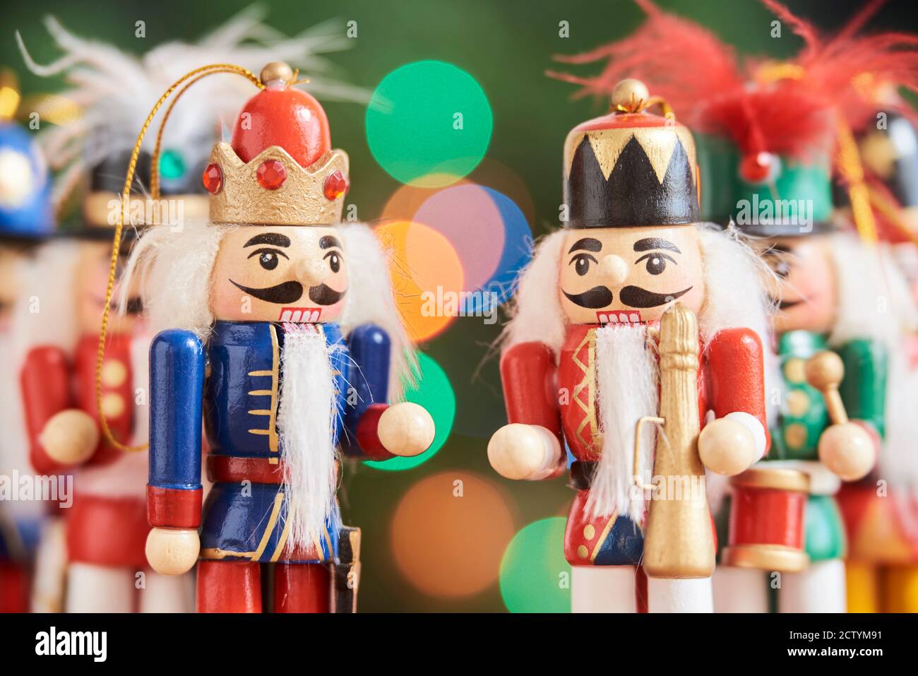 Traditional colorful Christmas nutcrackers with a green background with ...