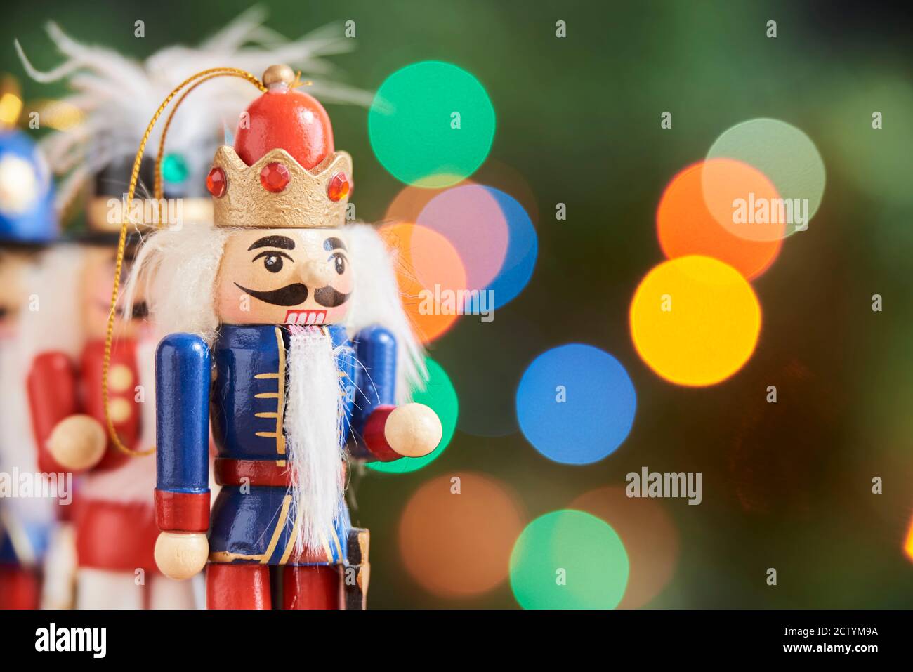 Traditional colorful Christmas nutcrackers with a green background with ...