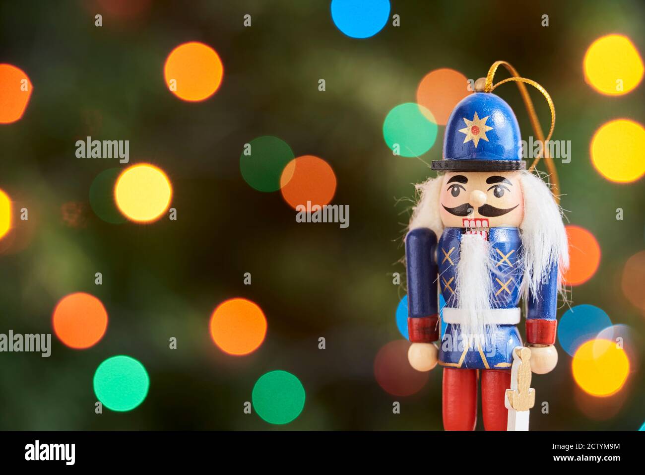 Traditional colorful wooden Christmas nutcracker with a green ...