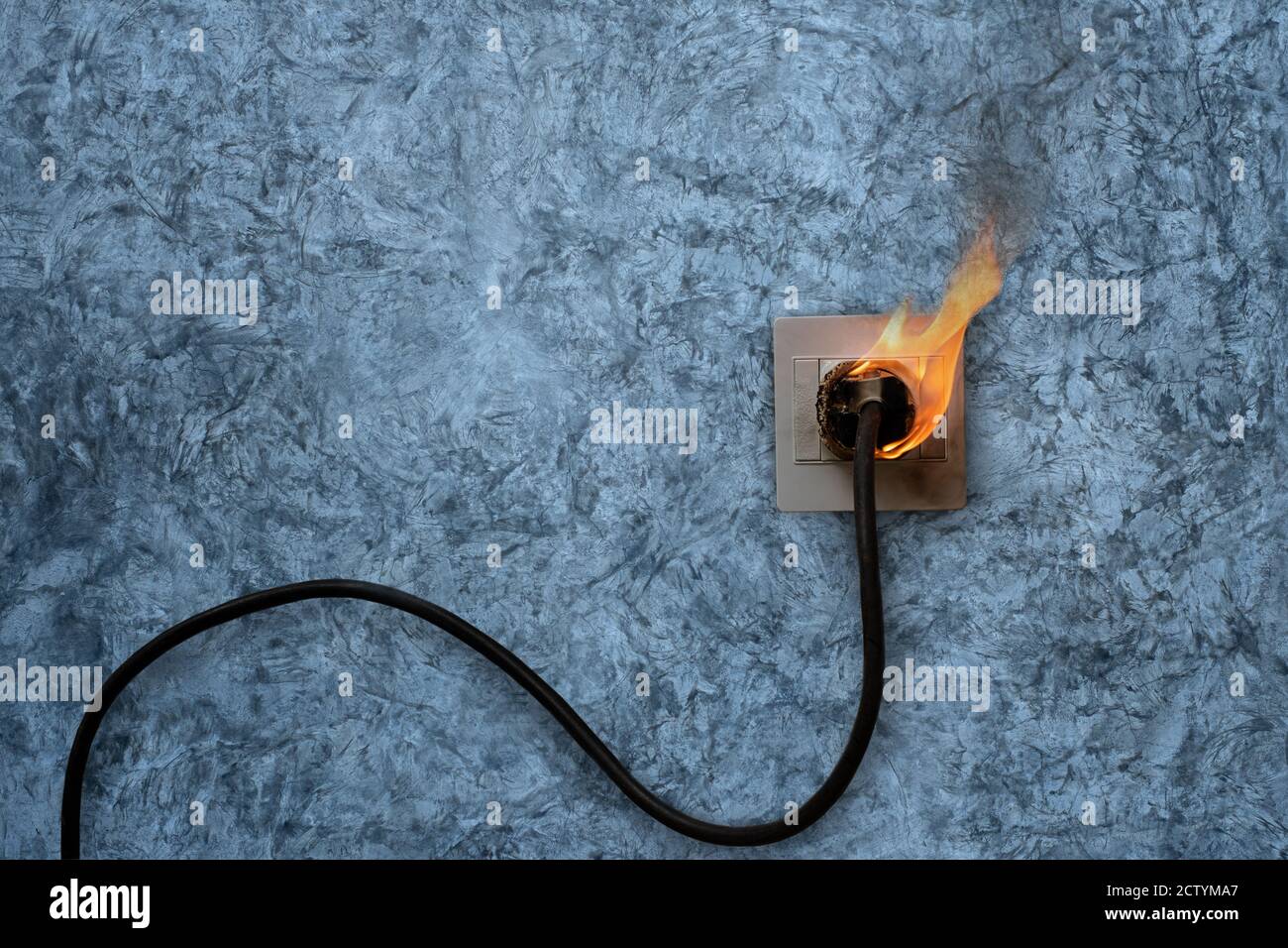 On fire electric wire plug Receptacle on the concrete wall exposed ...