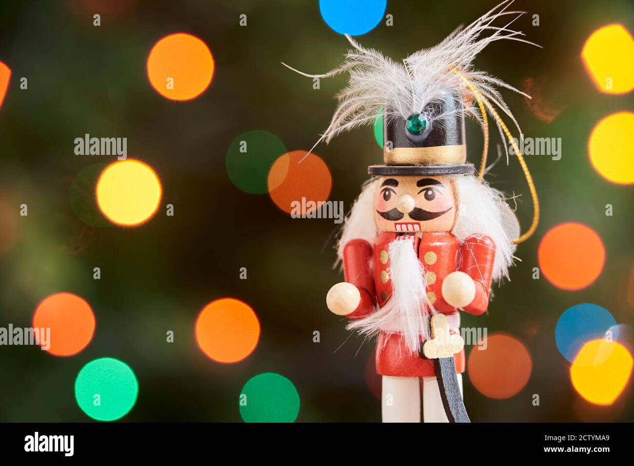 Traditional wooden Christmas nutcracker with a green background with ...