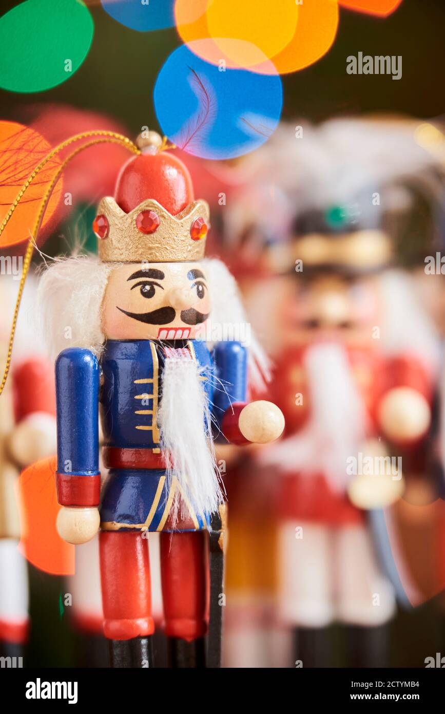 Traditional colorful Christmas nutcrackers with colored out of focus ...