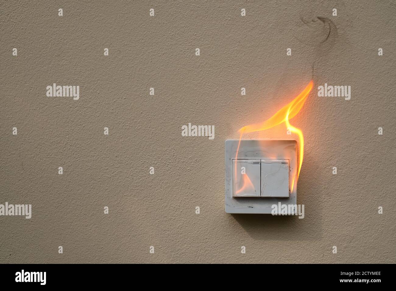 On fire switch electric shock on concrete wall Stock Photo - Alamy