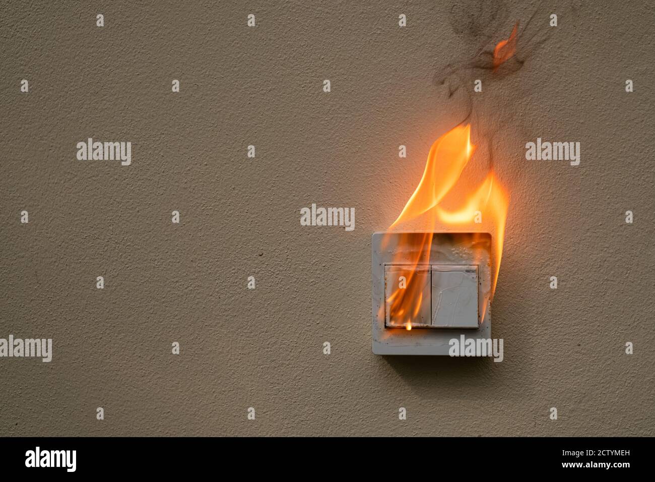 On fire switch electric shock on concrete wall Stock Photo - Alamy