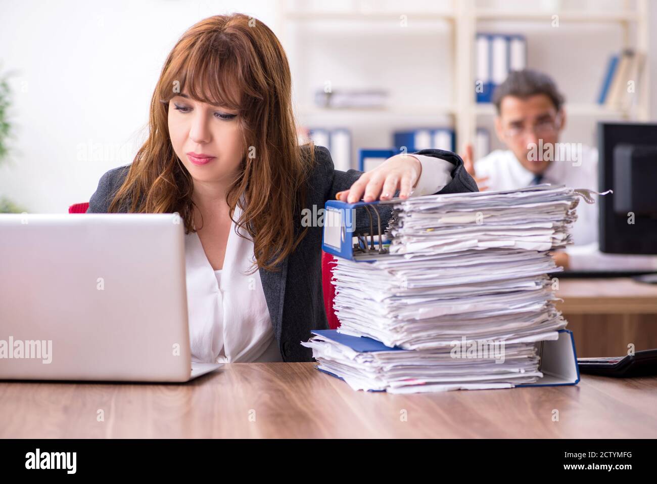 Two employees working in the office environment Stock Photo - Alamy