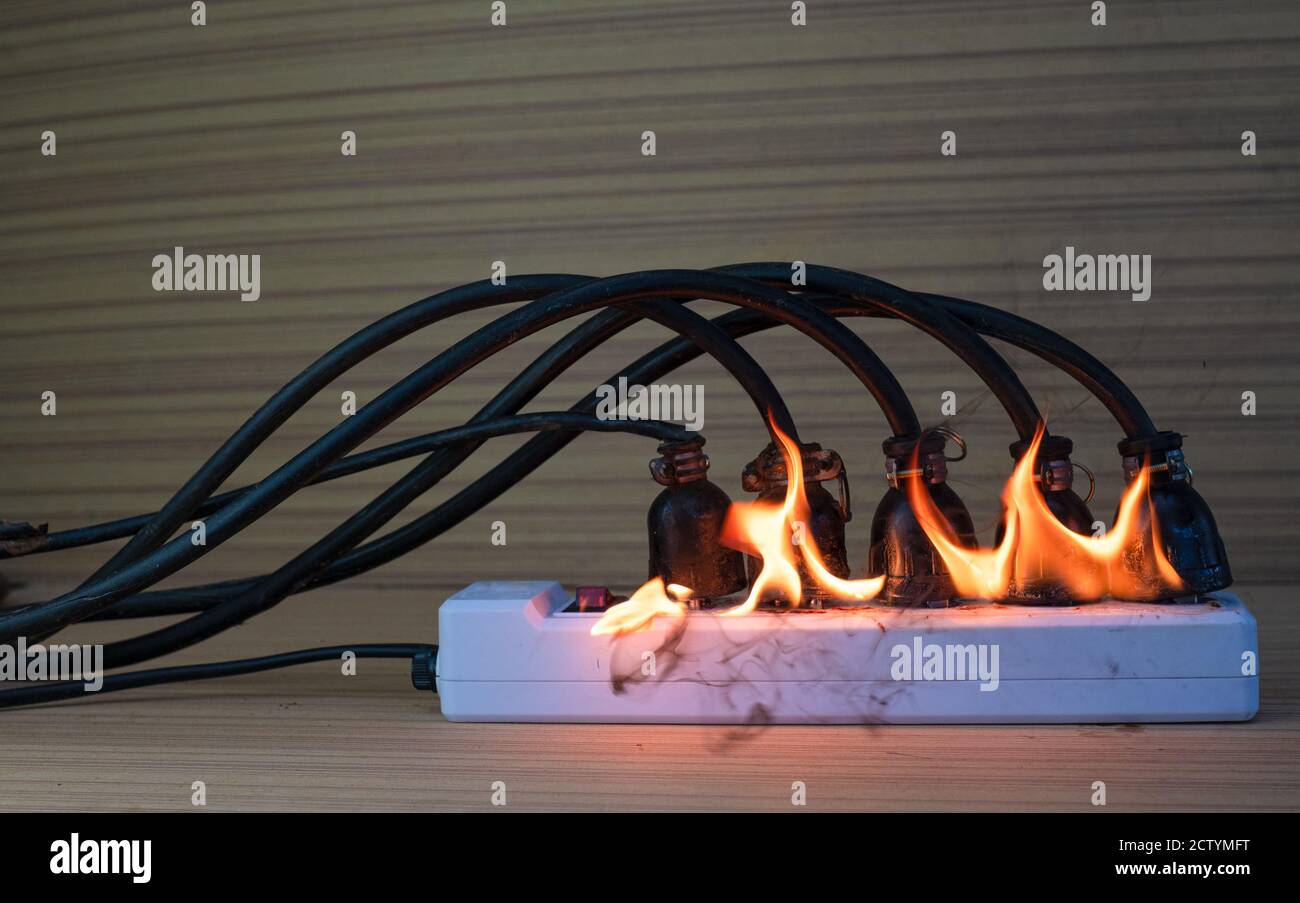 On fire multi socket with the connected power strip with a bunch of ...
