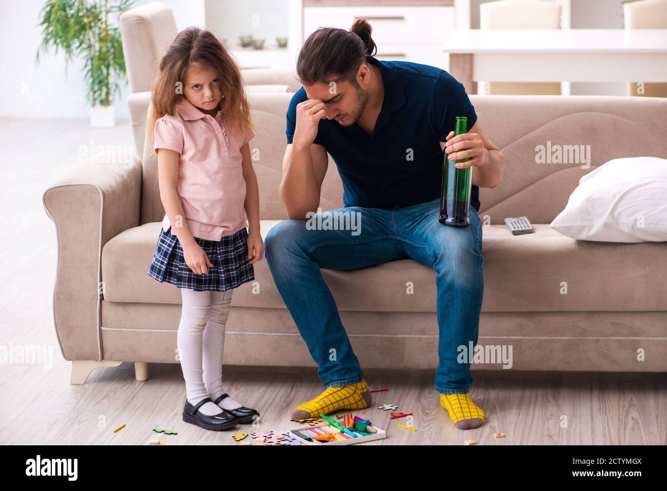 Drunk father and little girl at home Stock Photo - Alamy