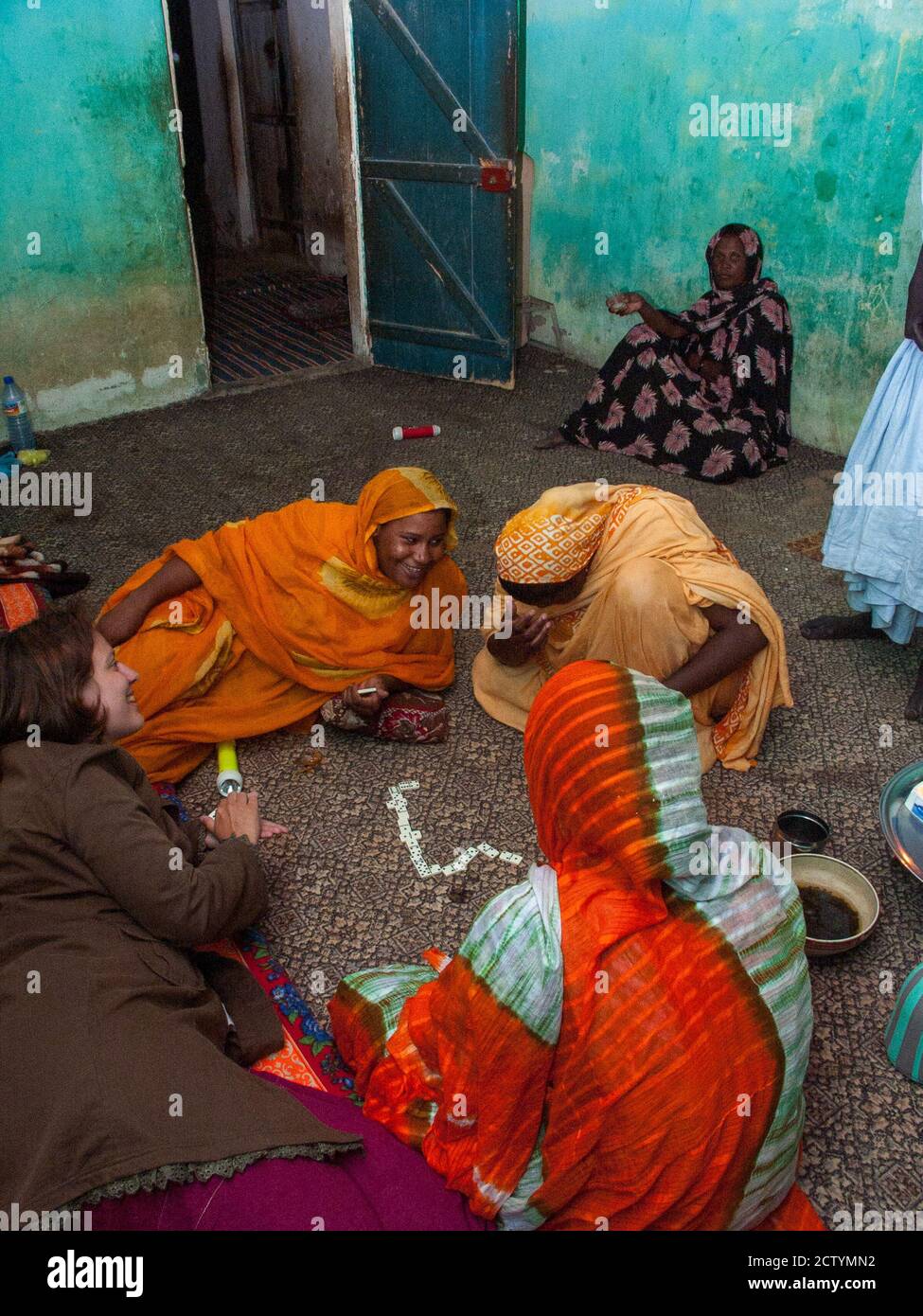 Sahara desert in Mauritania young people drinking mint tea and playing ...