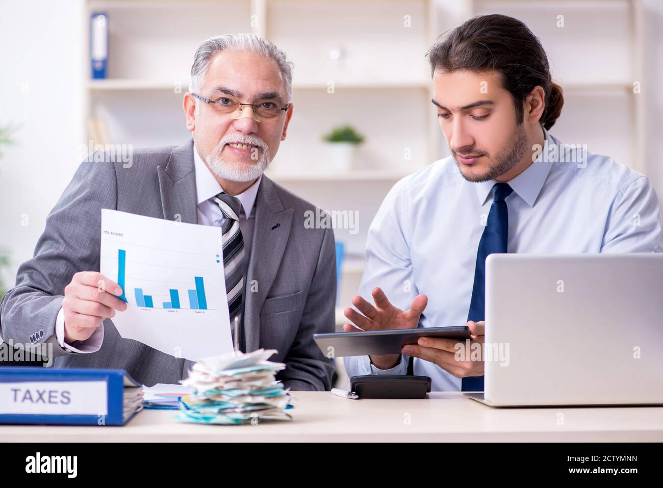 The two accountants working in the office Stock Photo - Alamy