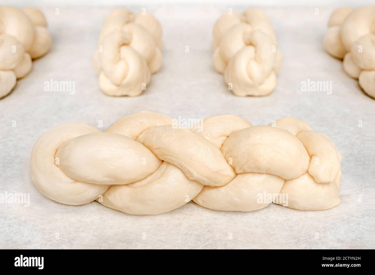 Homemade yeast dough braided in single portion buns. Traditional Swiss ...