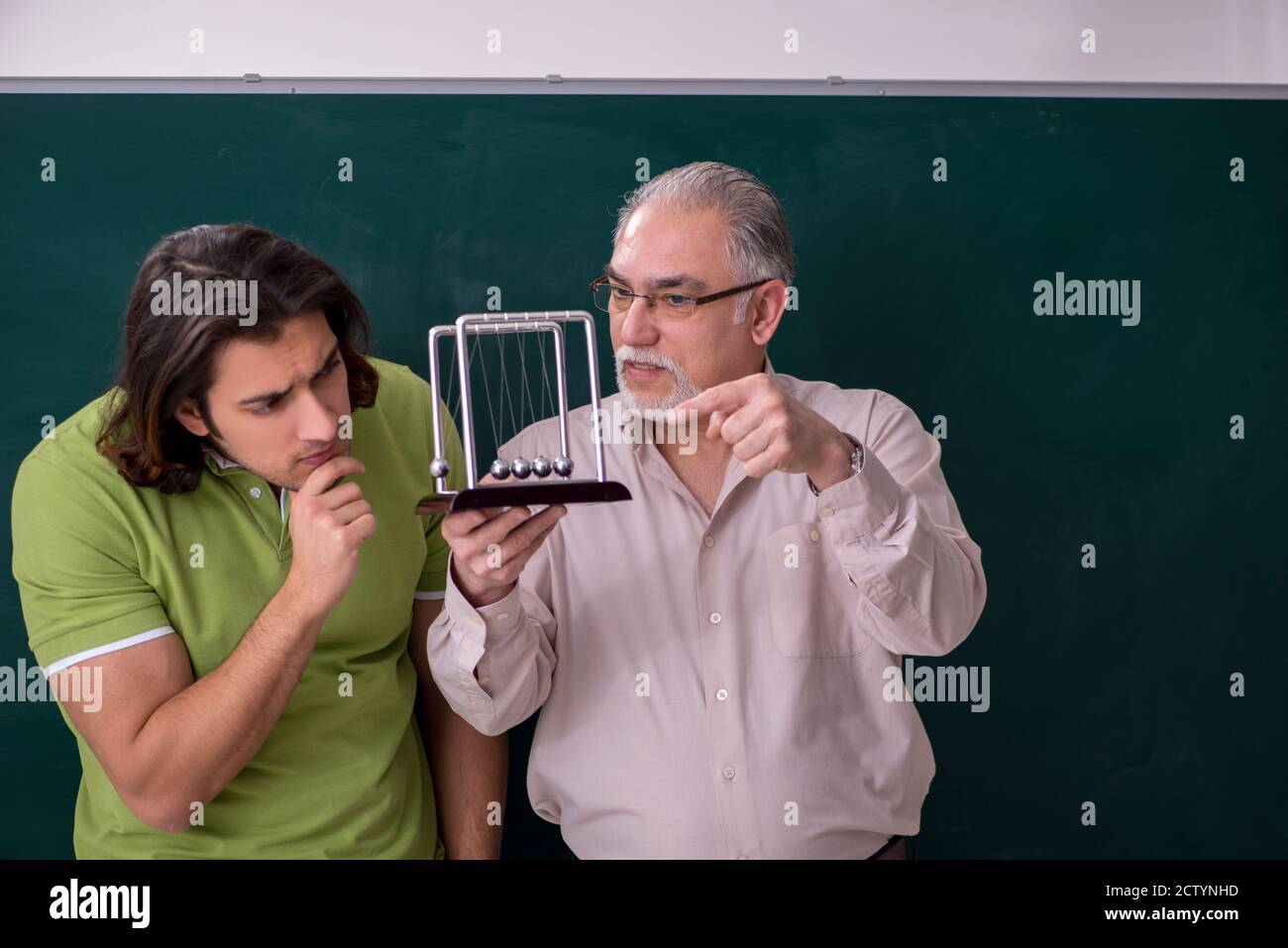 Old professor physicist and student in the classroom Stock Photo - Alamy