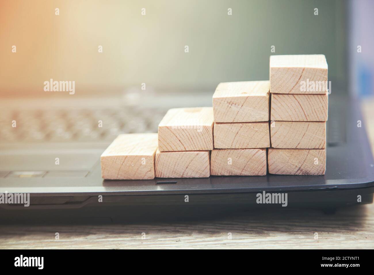 Stacks of Wooden Blocks on Computer Background Stock Photo - Alamy