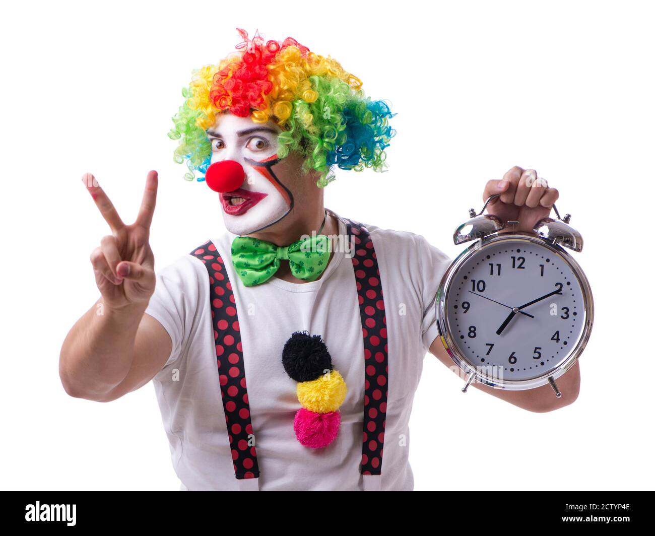 The funny clown with an alarm clock isolated on white background Stock ...