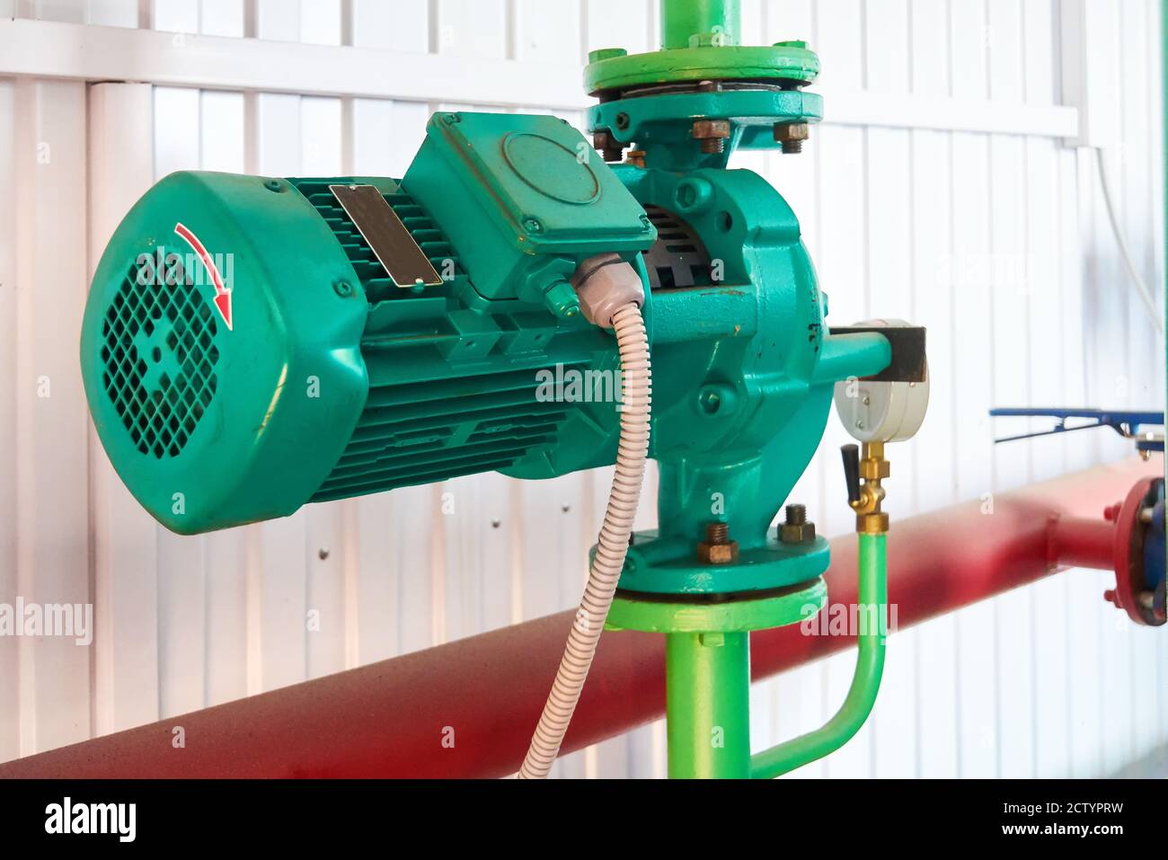 Green electric motor with pump on hot water pipeline Stock Photo - Alamy