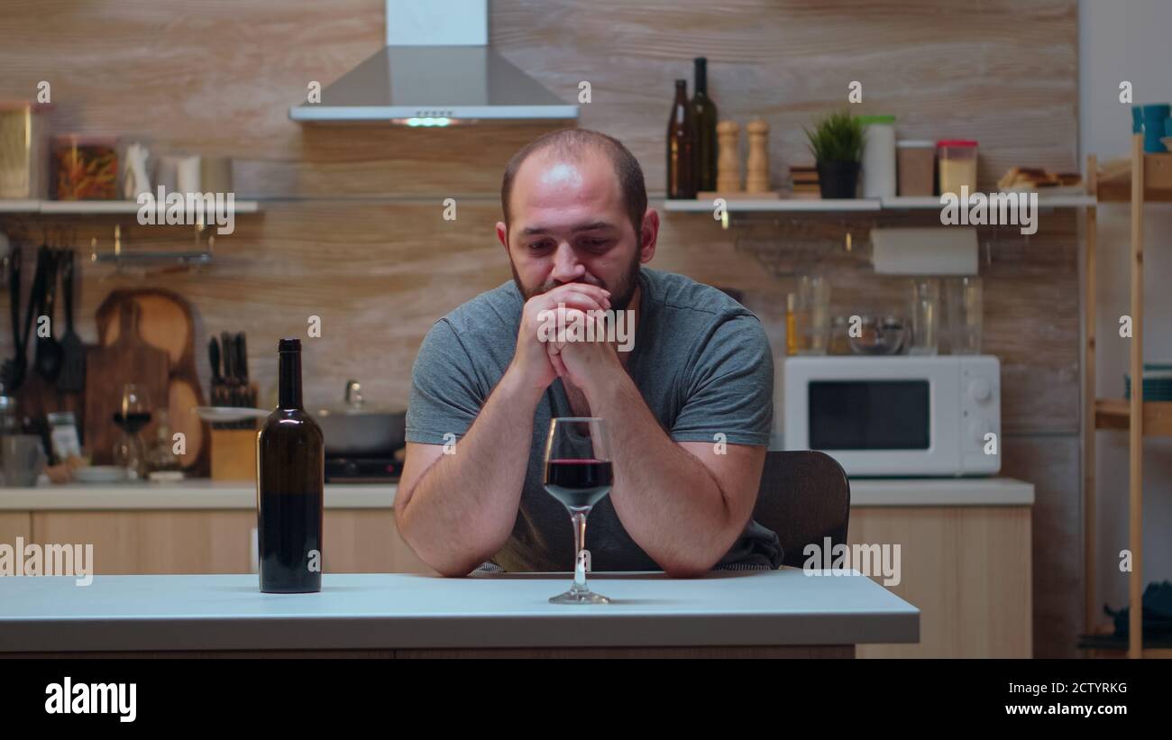 Alcoholic person with headaches trying to refrain. Unhappy person ...